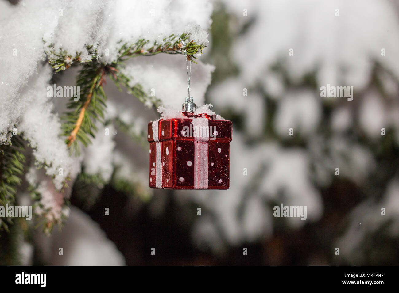 Christmas decorations on a fir tree, with snowflakes, mild light, gifts ...