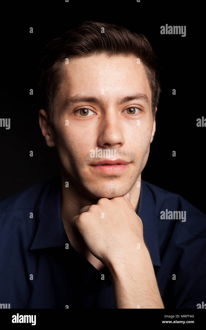 Fashion portrat of young man on black background in studio photo Stock ...