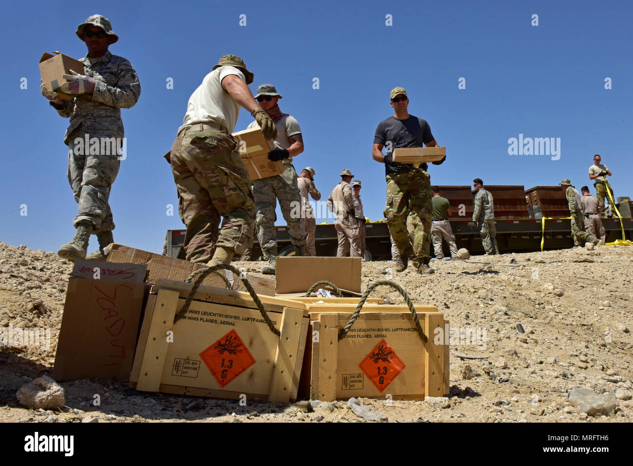 Members from the 407th Air Expeditionary Group unload ordnance and ...