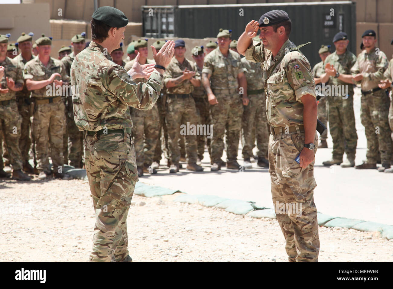 British Maj. Gen. Rupert Jones congratulates a British soldier during ...