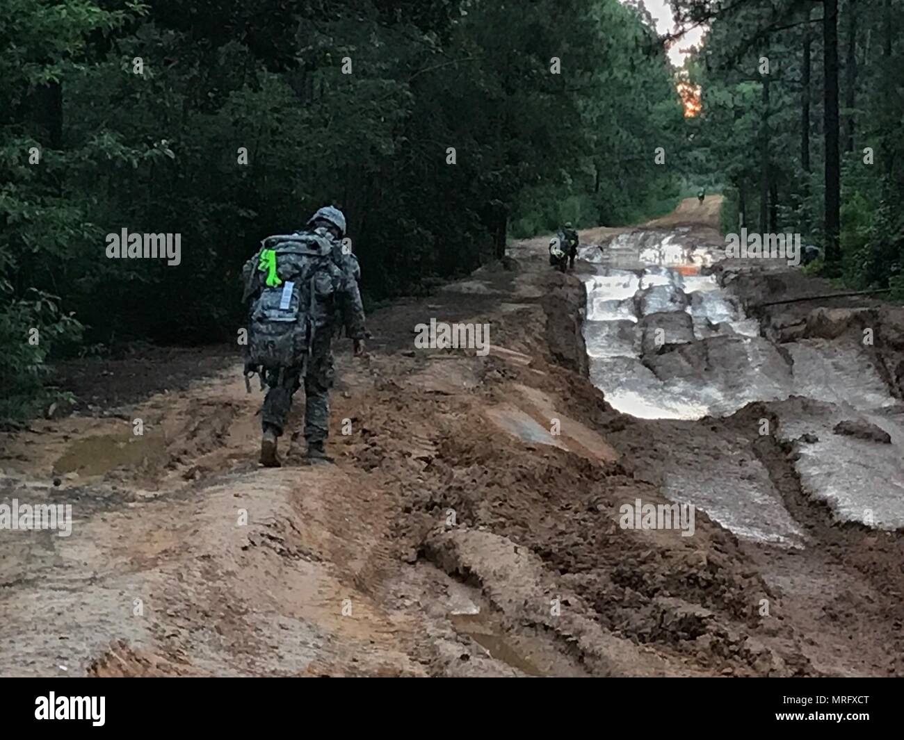 A U.S. Army Reserve Best Warrior candidate, negotiates a muddy tank ...