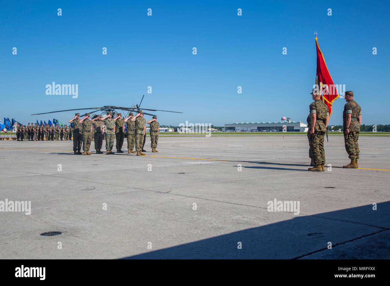 The ceremony staff, left, salutes during the Center for Naval Aviation ...