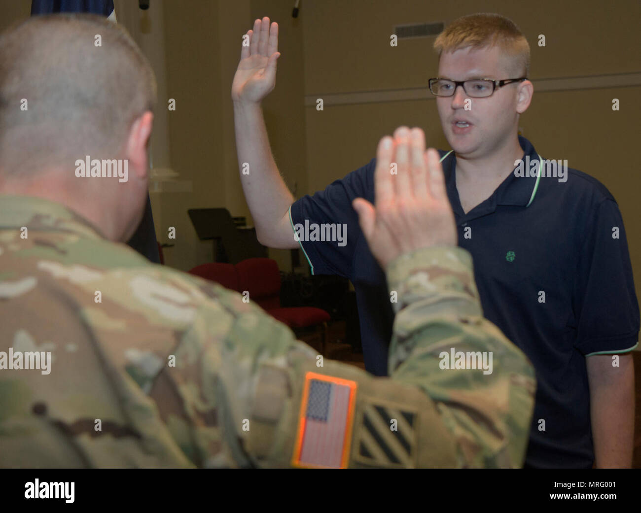 Caleb B. Walker recites the oath of enlistment, April 13, 2017 at Fort ...