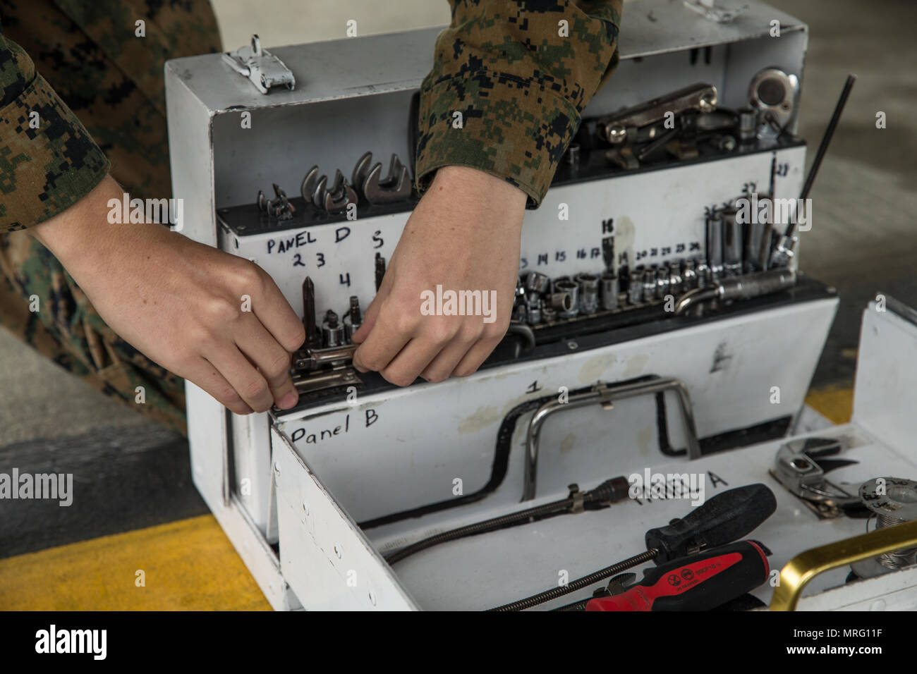 A U.S. Marine assigned to Marine Fighter Attack Squadron 251 opens a ...