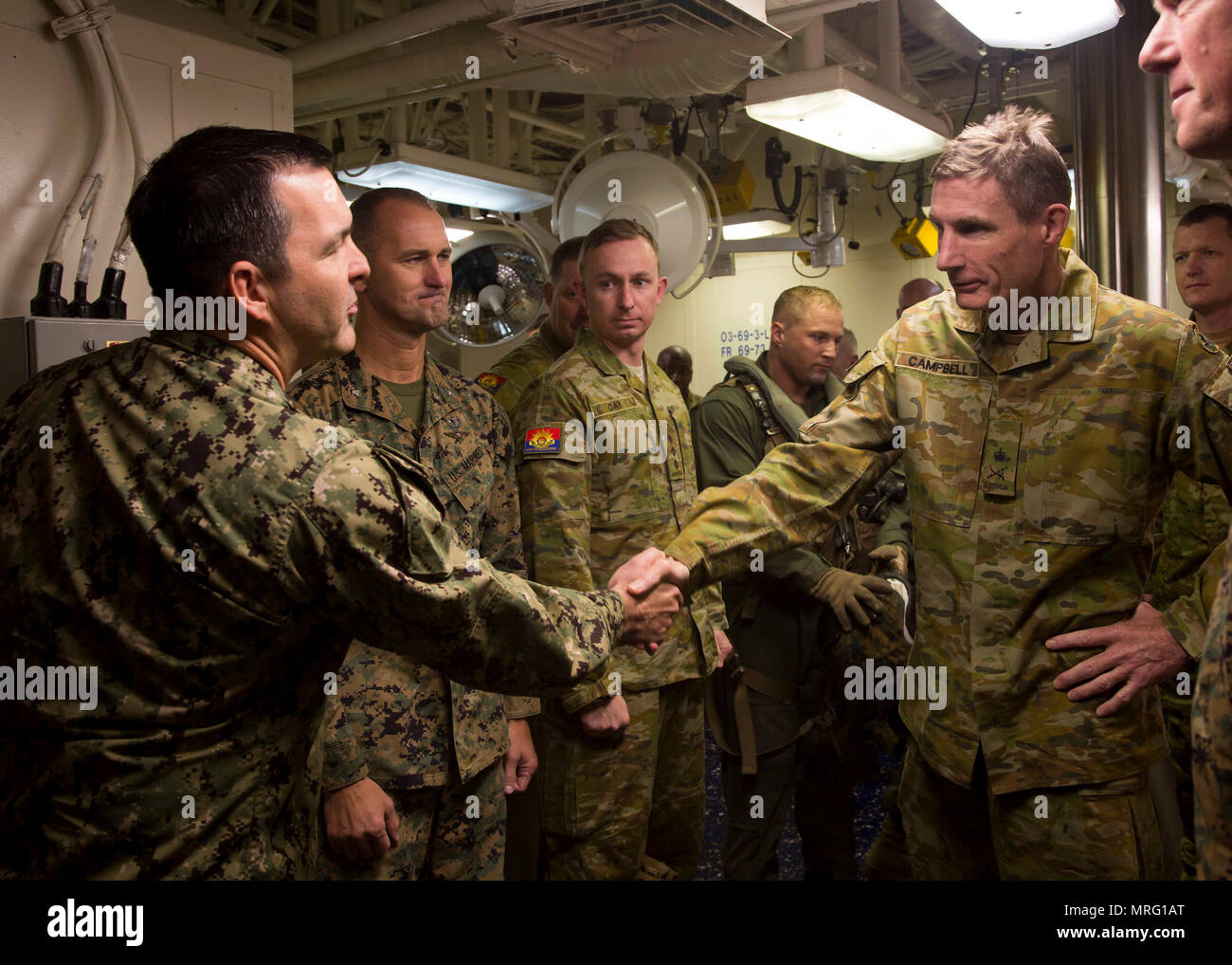 Left, Commander of Amphibious Squadron 3, U.S. Navy Capt. Rome Ruiz ...