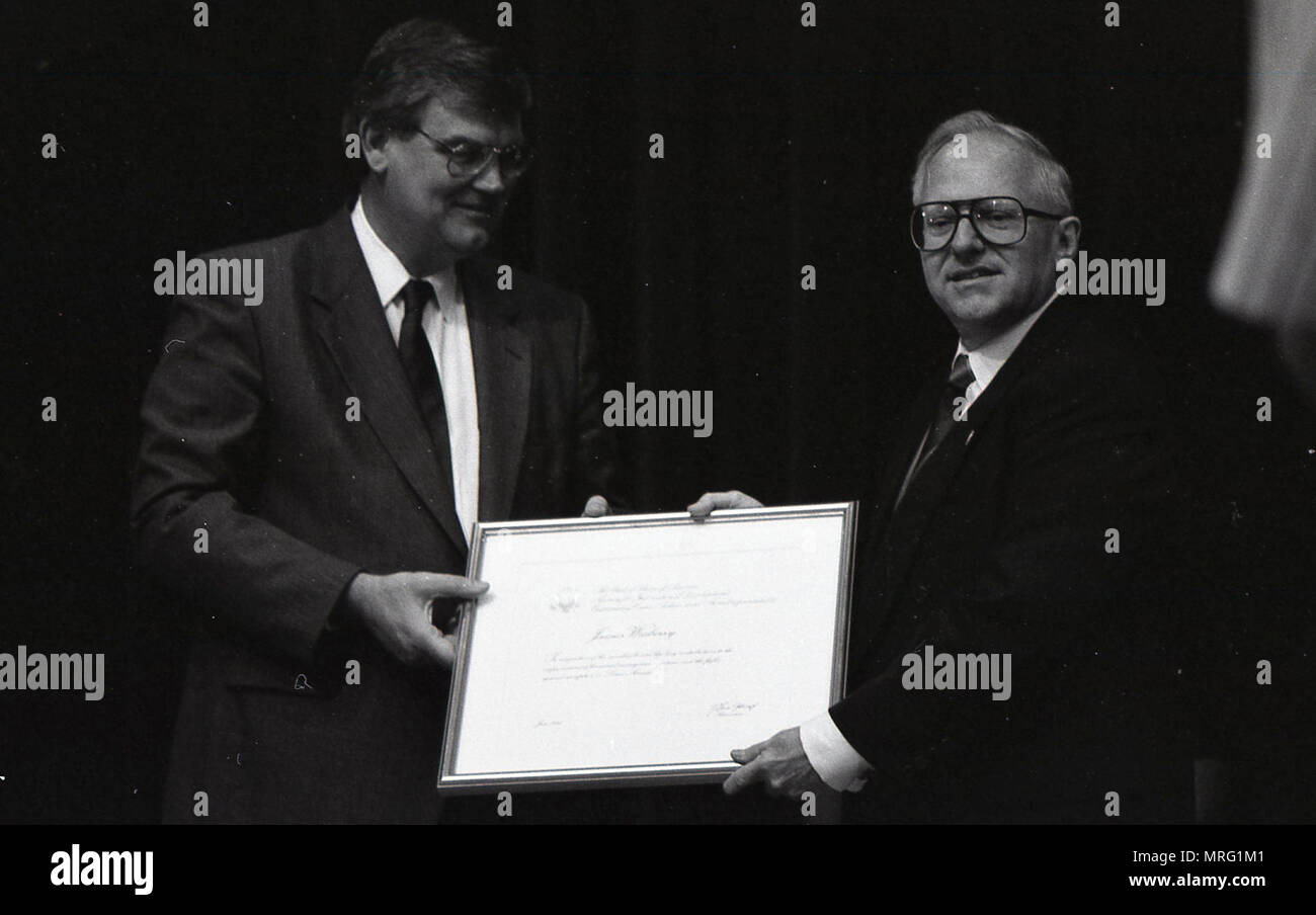 Admin. Atwood presenting general awards - Man receiving award on stage ...