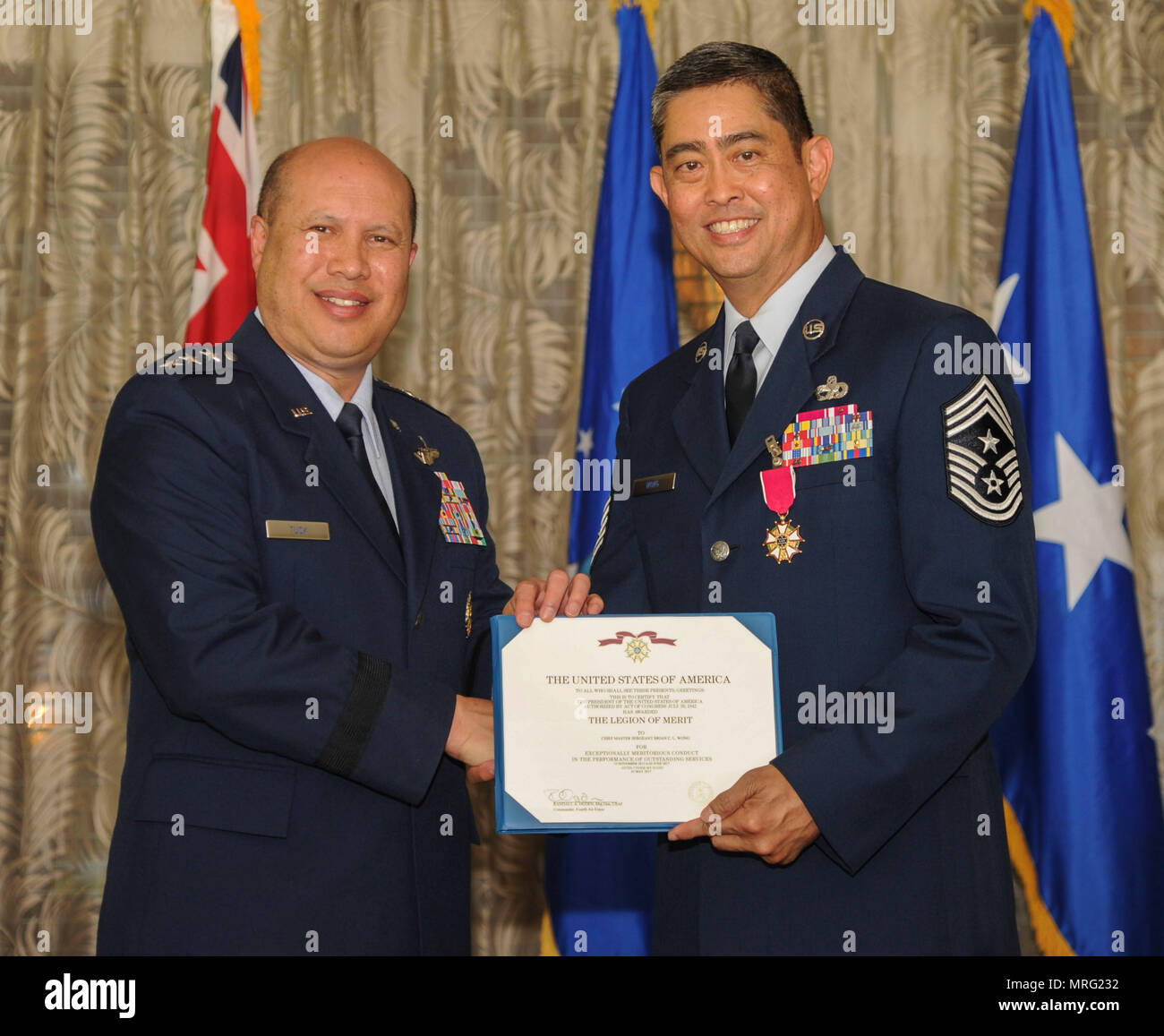 Lt. Gen. Giovanni Tuck, Eighteenth Air Force commander, presents the ...