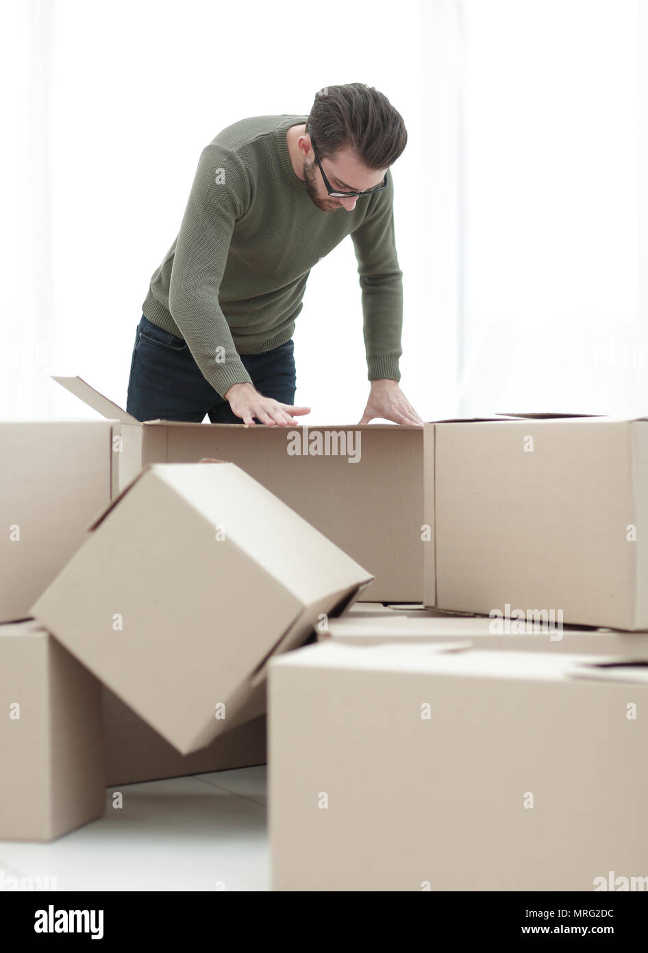 Male examining package hi-res stock photography and images - Alamy