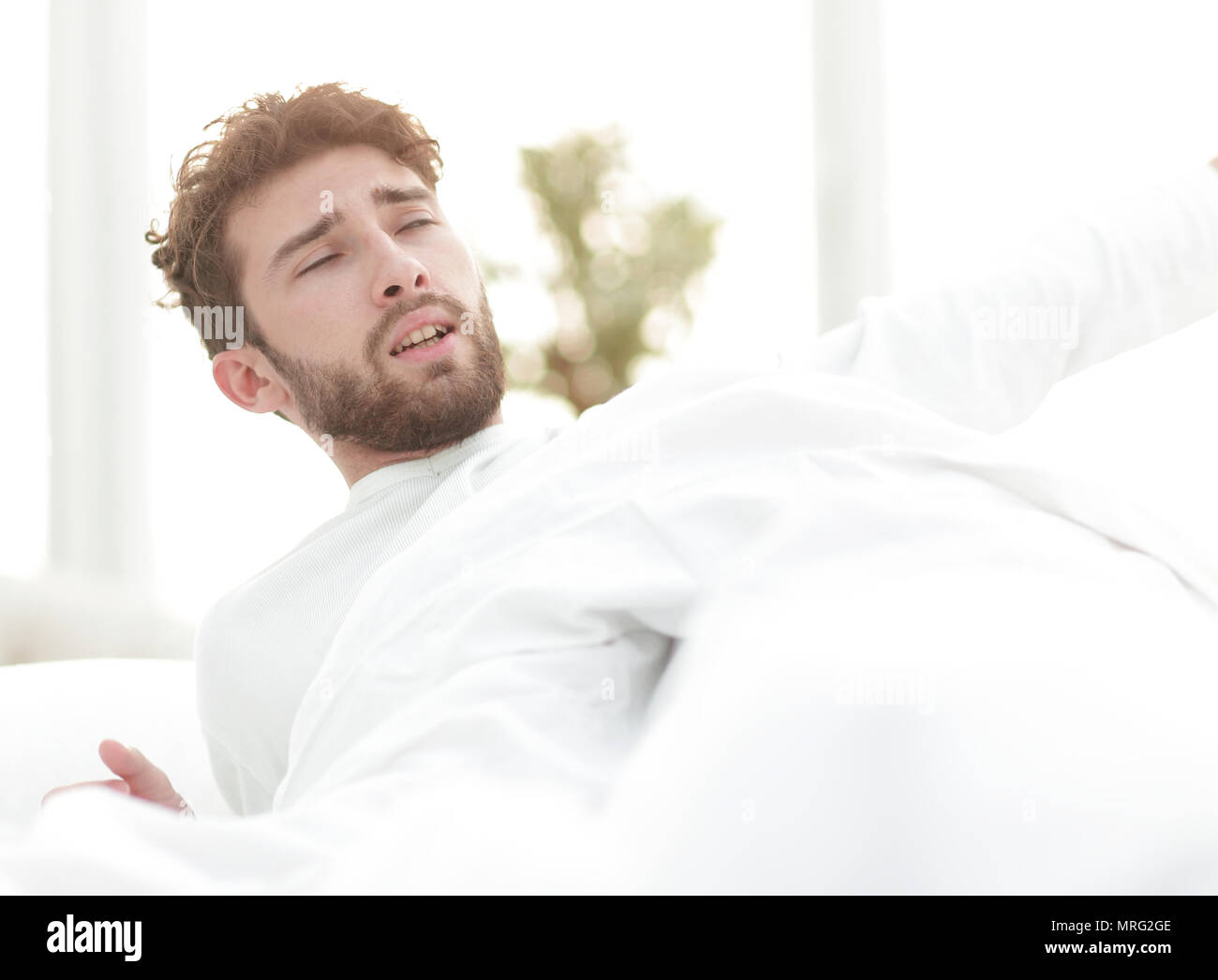 Sofa bed sleeping man hi-res stock photography and images - Alamy