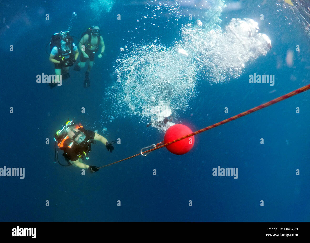 Members of the Royal Canadian Navy Fleet Diving Unit prepare to surface ...