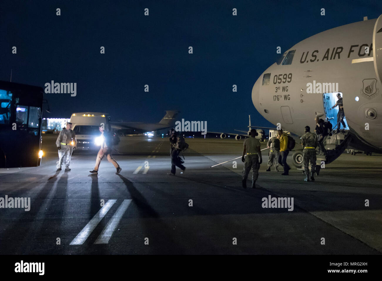U.S. Army Solders get off a C-17 Globemaster III at Yokota Air Base ...