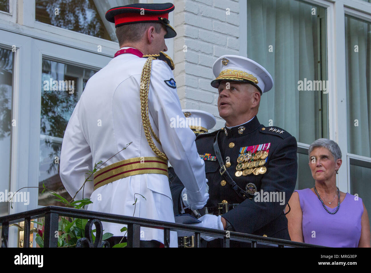 Commandant of the Marine Corps Gen. Robert B. Neller, right, shakes ...