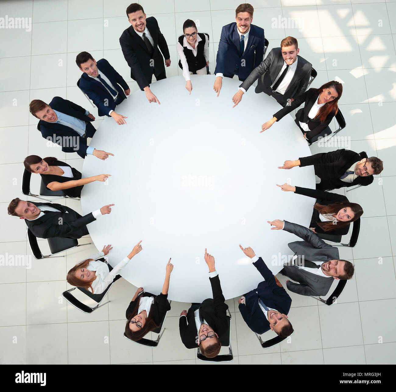 closeup .business team pointing in the center of the table Stock Photo ...