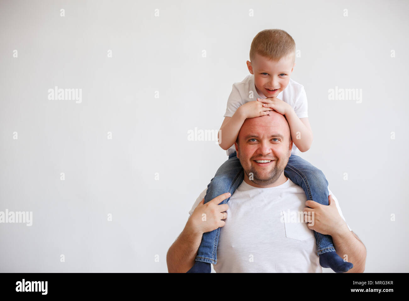 Child sits on shoulders hi-res stock photography and images - Alamy