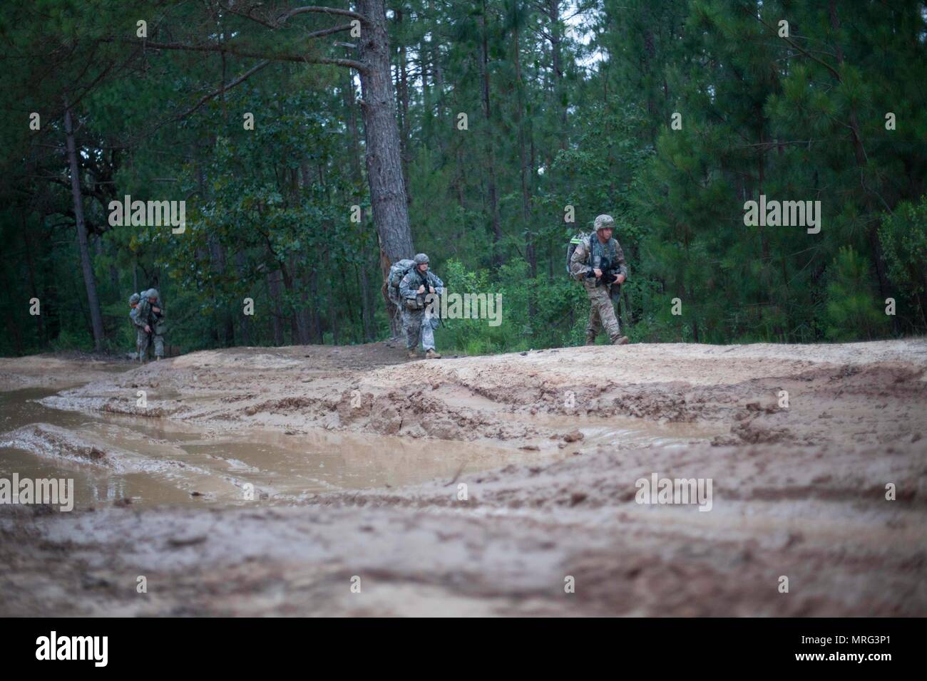 Warriors maneuver through muddy terrain during Foot March, at the 2017 U.S. Army Reserve Best ...