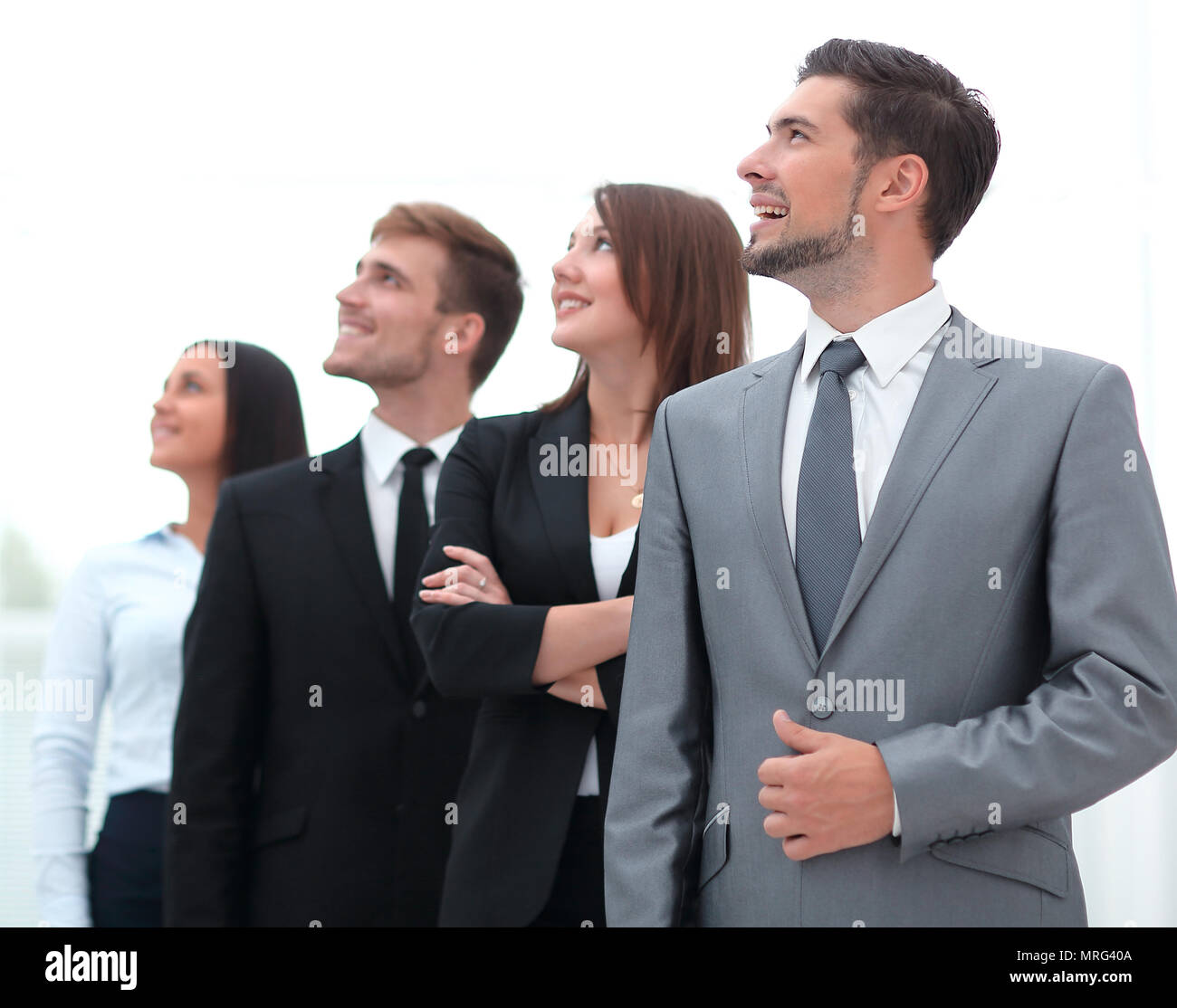 business team standing one behind the other and looking forward Stock ...