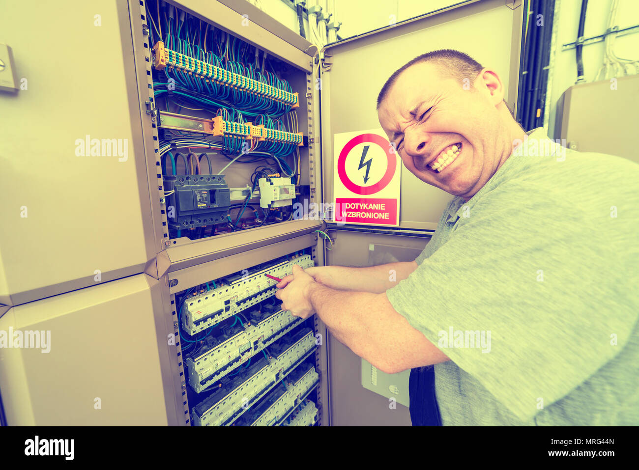 electrician electrocuted. grimace of pain on his face Stock Photo - Alamy