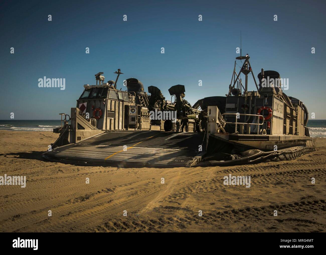 Sailors marines unload cargo from landing craft air cushion hi-res ...