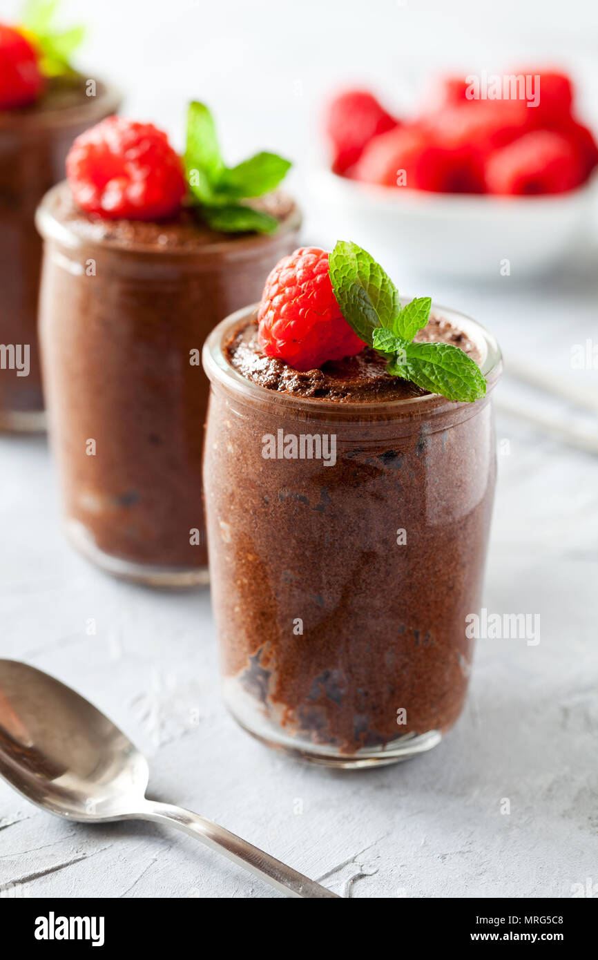 Glass of homemade dark chocolate mousse with raspberries Stock Photo ...
