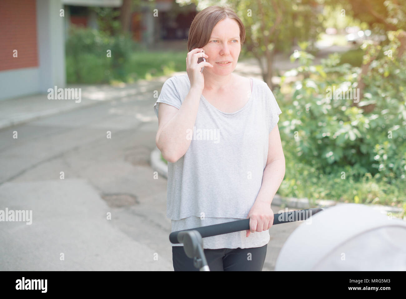 Anxious mother phone hi-res stock photography and images - Alamy