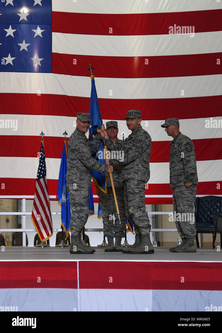 Gen. Mike Holmes, Air Combat commander, right, receives the guidon from ...