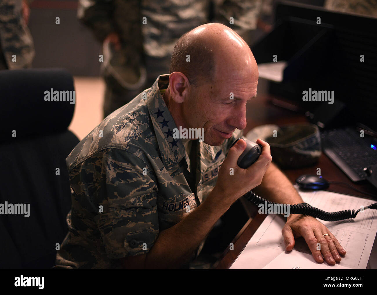 Gen. Mike Holmes, Air Combat Command commander, makes a test call using ...
