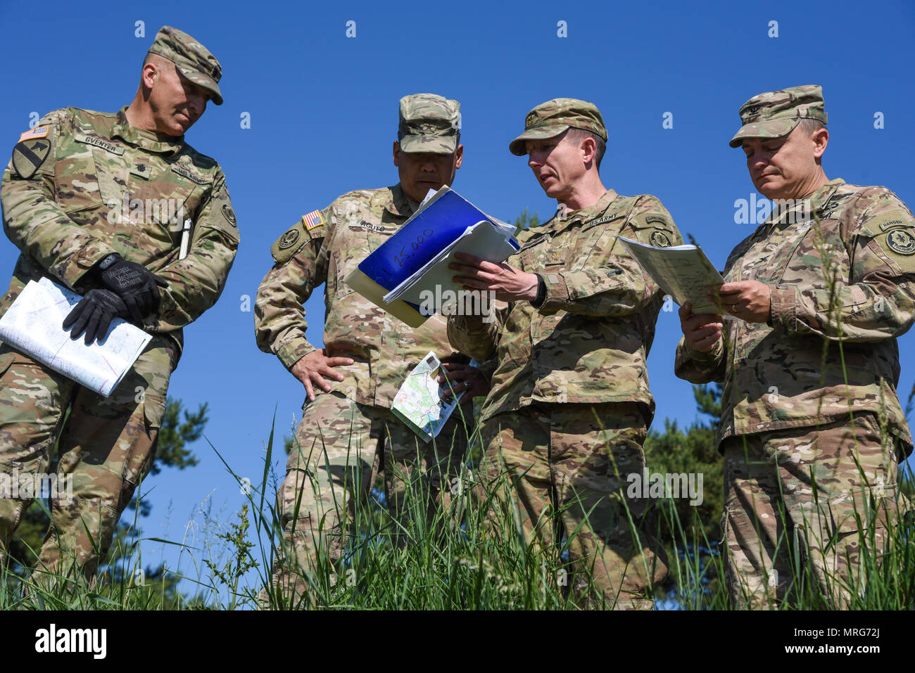 U.S. Army Brig. Gen. Tony Aguto, second from left, Commanding General ...