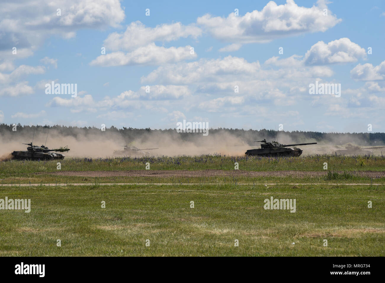 Lithuanian Army tanks maneuver through the Bemowo Piskie Training Area ...