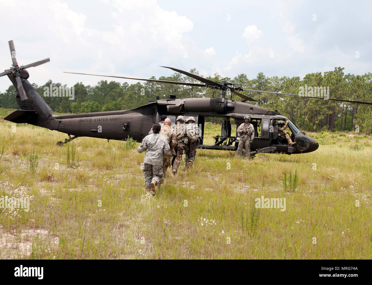 A team of Warriors completes Mystery Event Day 4 and load onto a UH-60 ...