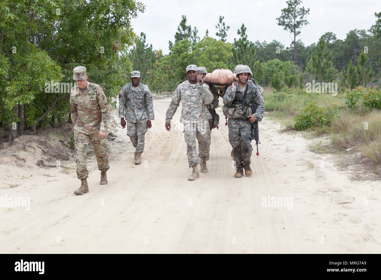 Warriors conduct a 4-man carry on a simulated Soldier during a mystery ...