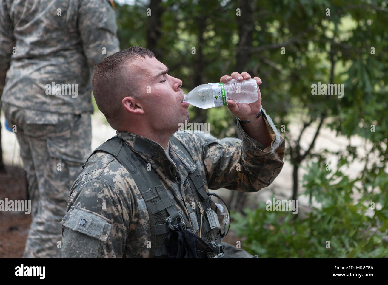 Sgt. Benjamin Poulin, 824th Transportation Company, drinks water after ...