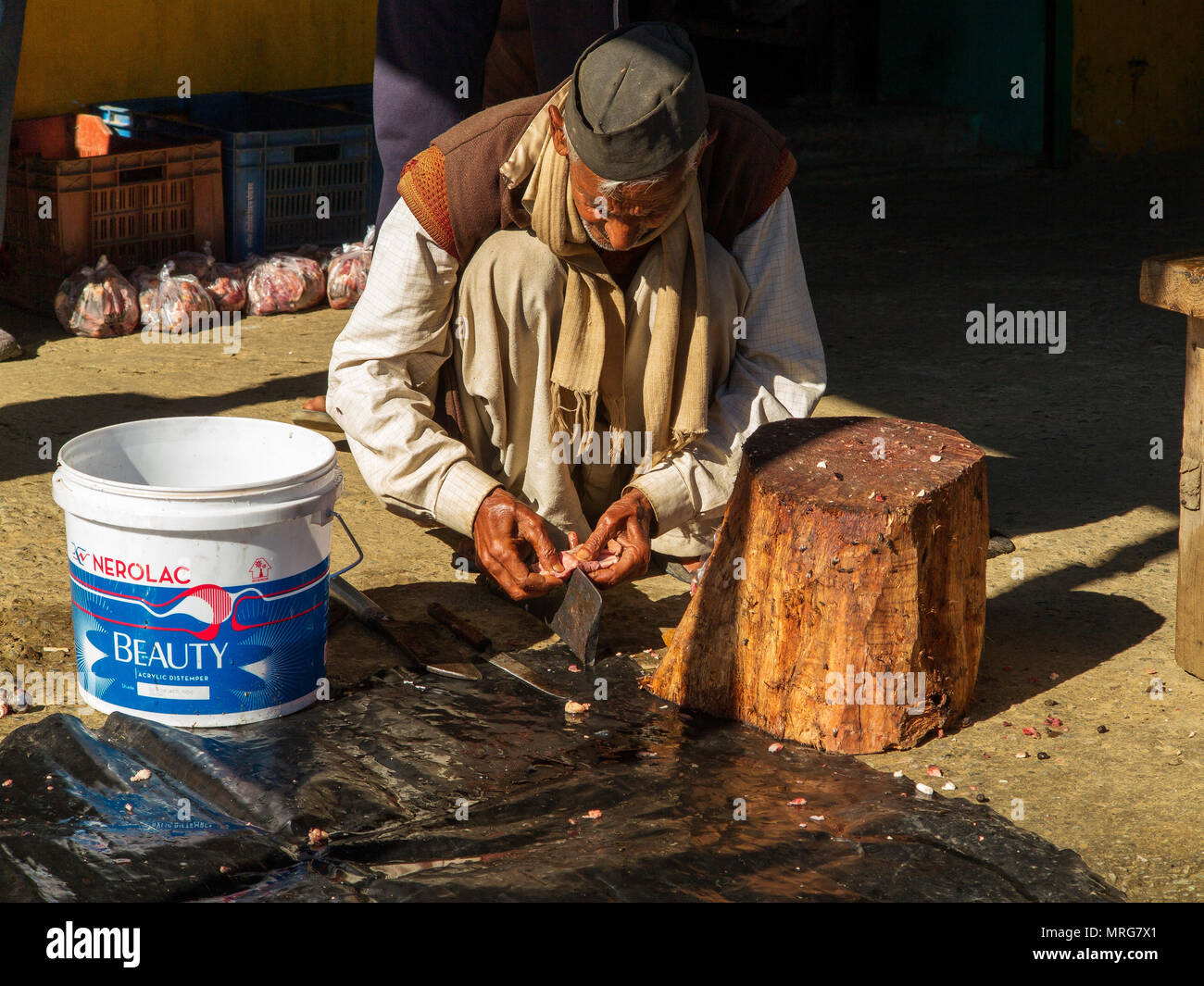 Old man selling meat at the streets of Lamgara Village, Kumaon Hills ...
