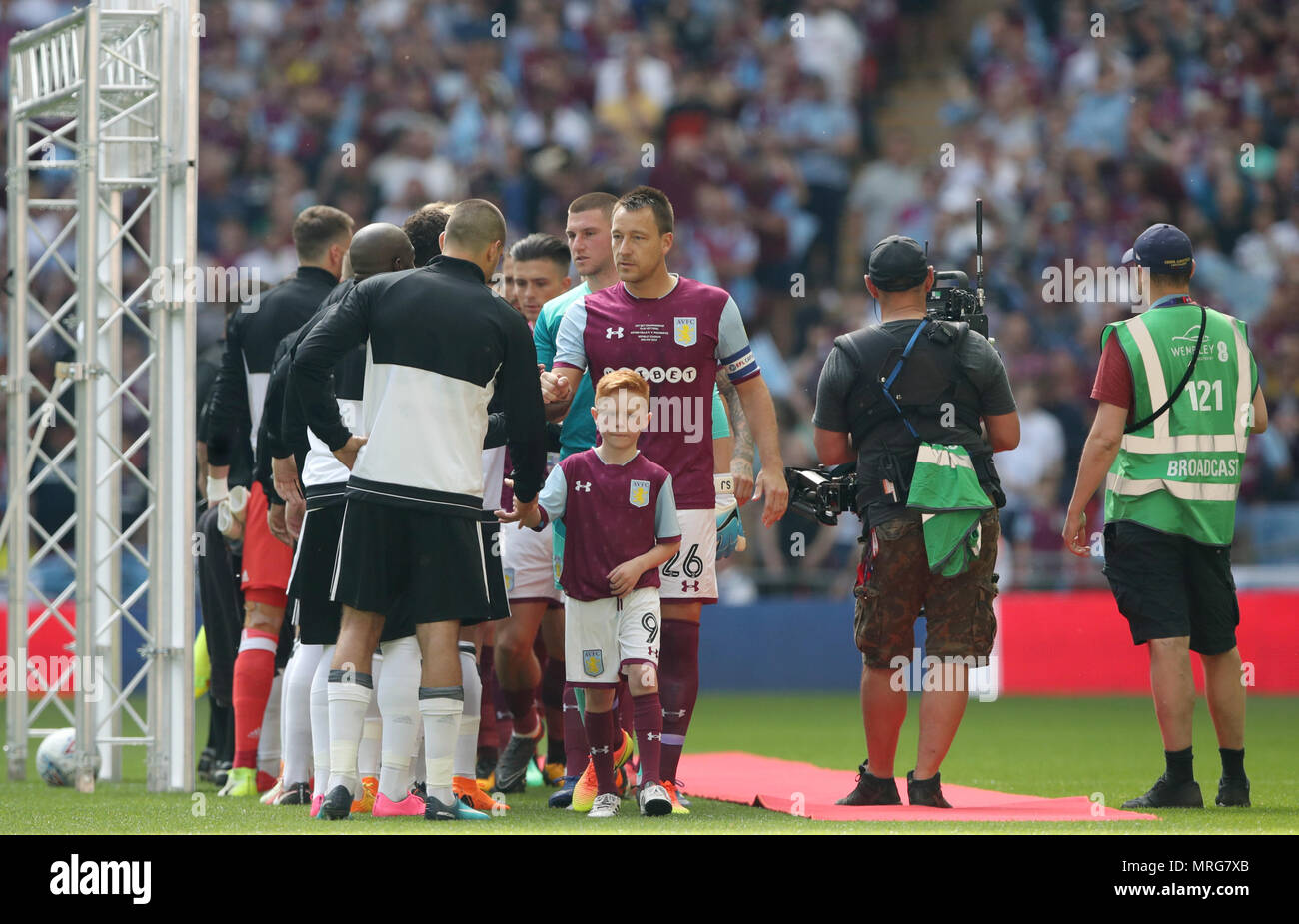 Aston Villa's John Terry and competition winning mascot Hayden Farnell ...