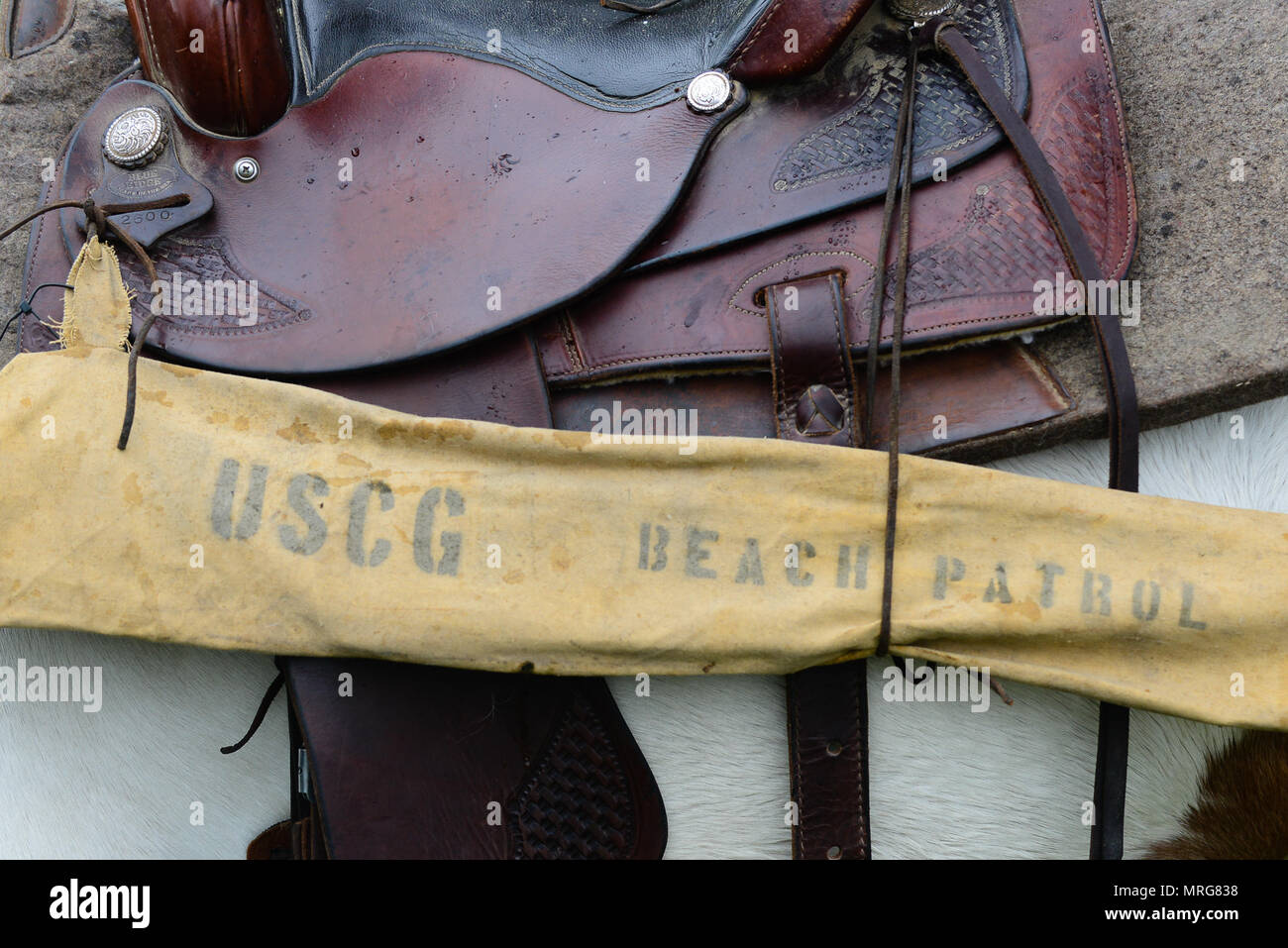 A Coast Guard World War II beach patrol reenactors horse carries a ...