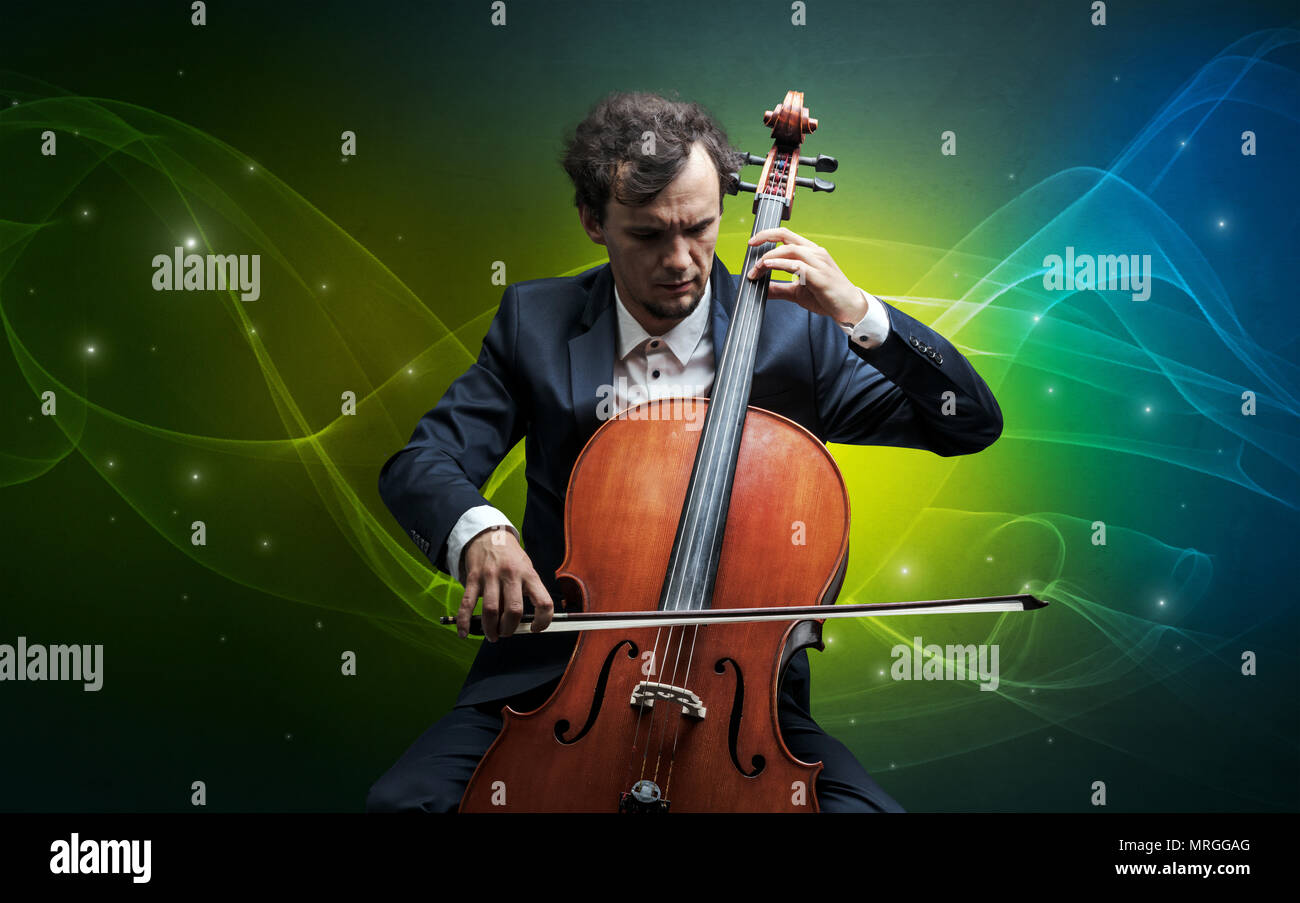 Serious classical cellist with fabled sparkling wallpaper Stock Photo ...