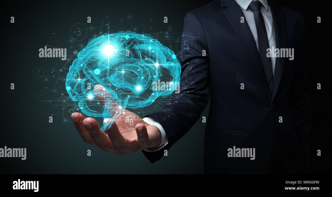 Businessman holding human brain on his hand with logistics symbols ...