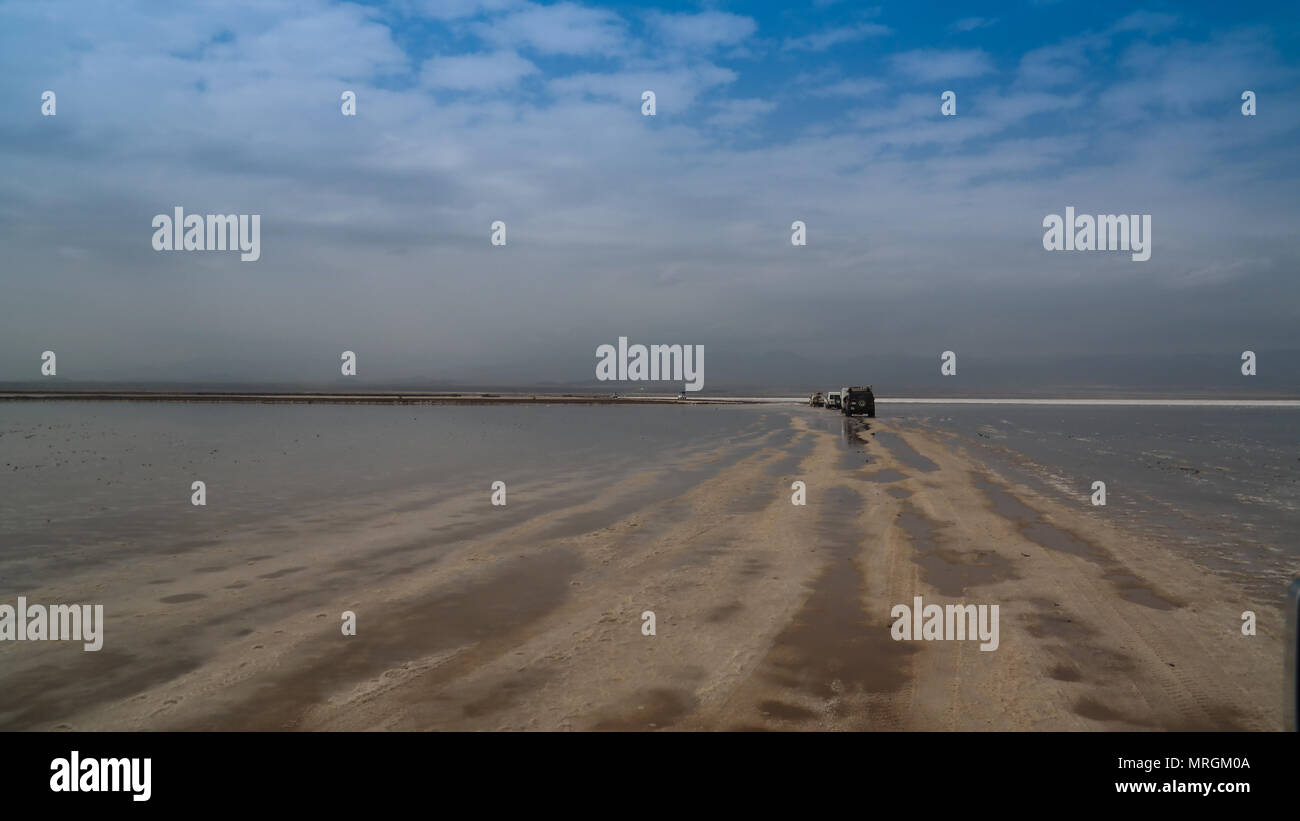 Cars at Salt Lake Karum aka Lake Assale or Asale at sunset in Danakil ...