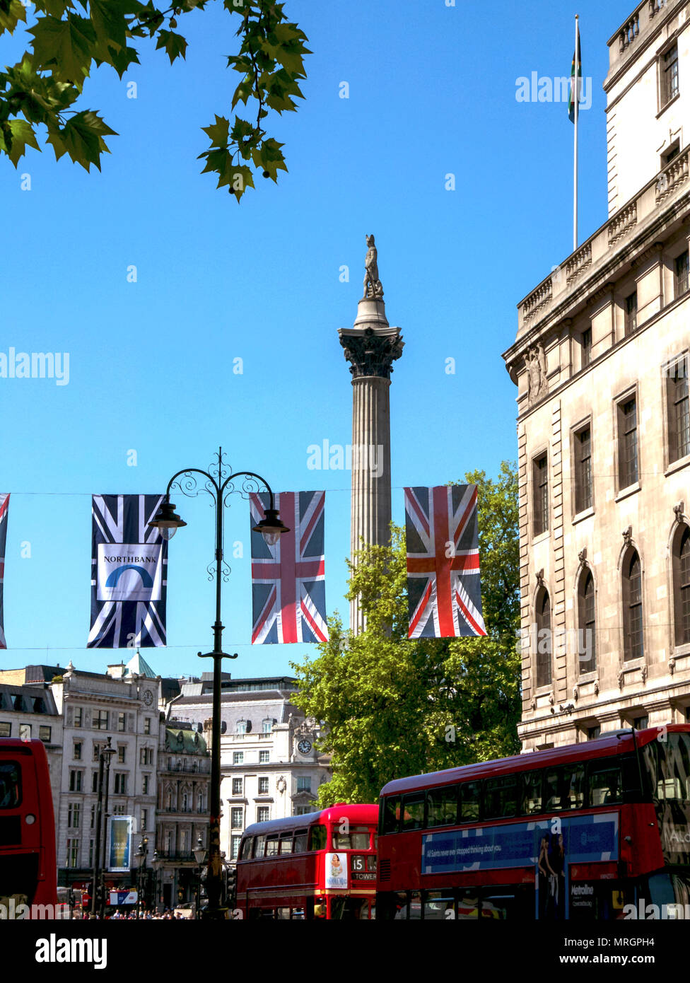 Looking down Strand to Trafalgar Square and Nelson's Column with Royal ...