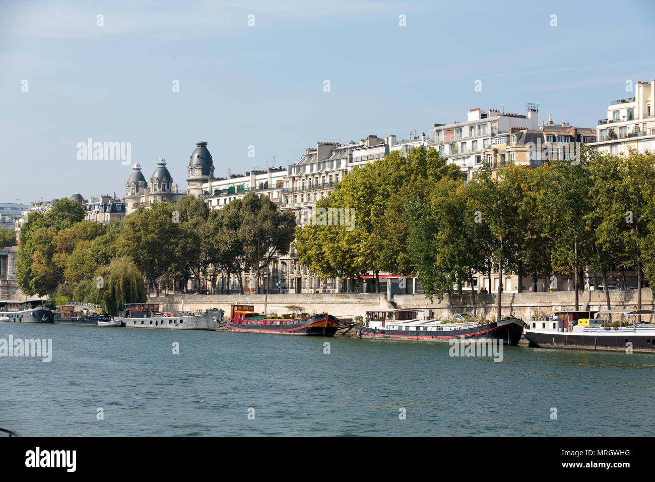 Famous quay of Seine in Paris with barges in Summer day. Paris, France ...