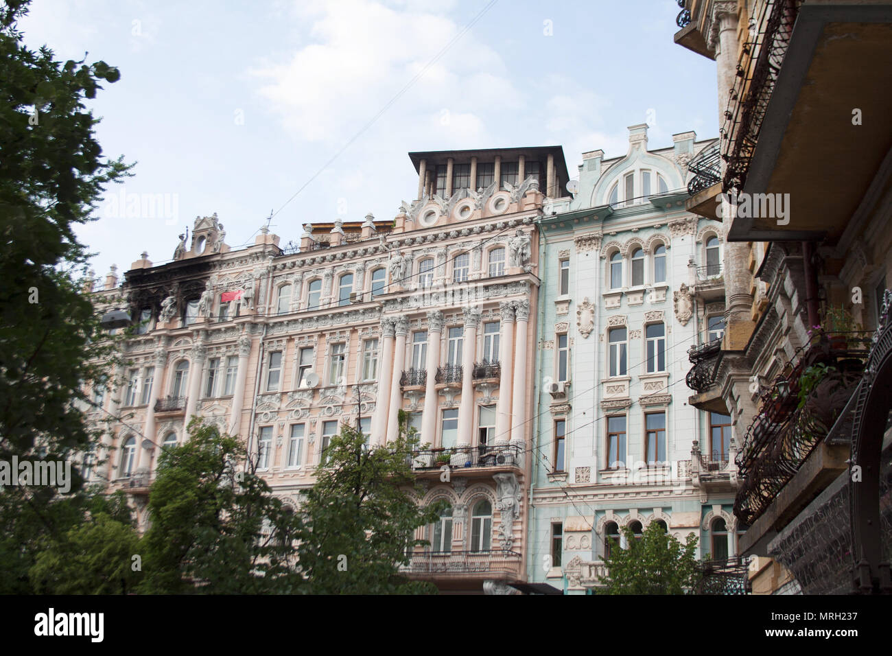 Old architecture buildings facades with stucco, sculptures and ...