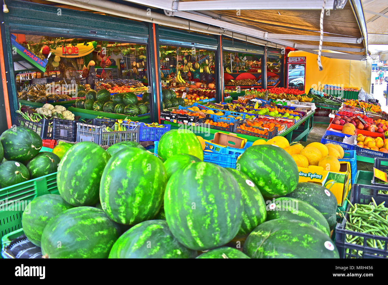 A colourful display of fresh fruit and vegetables in a market stall on ...