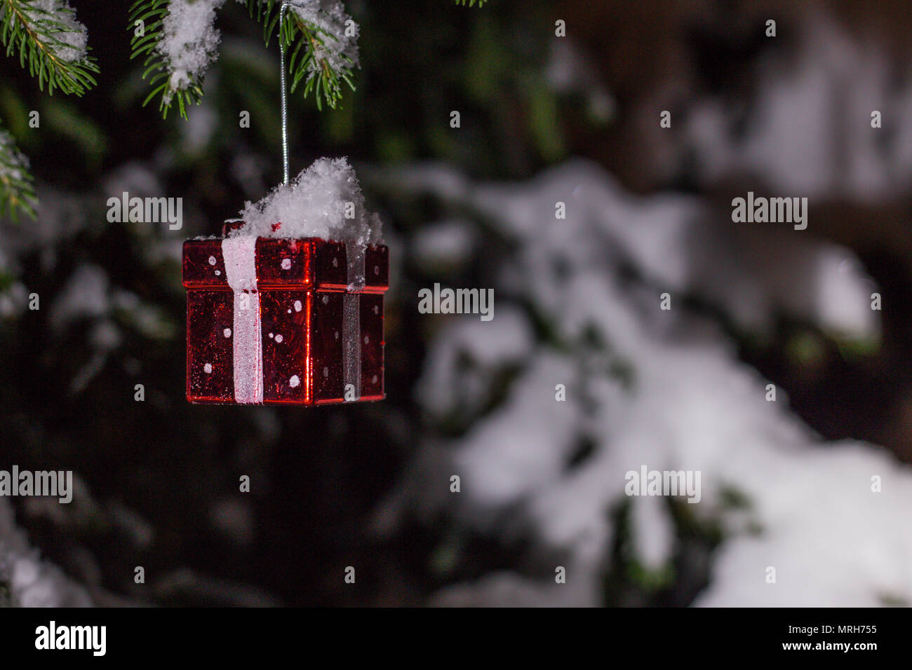 Christmas decorations on a fir tree, with snowflakes, mild light, gifts ...