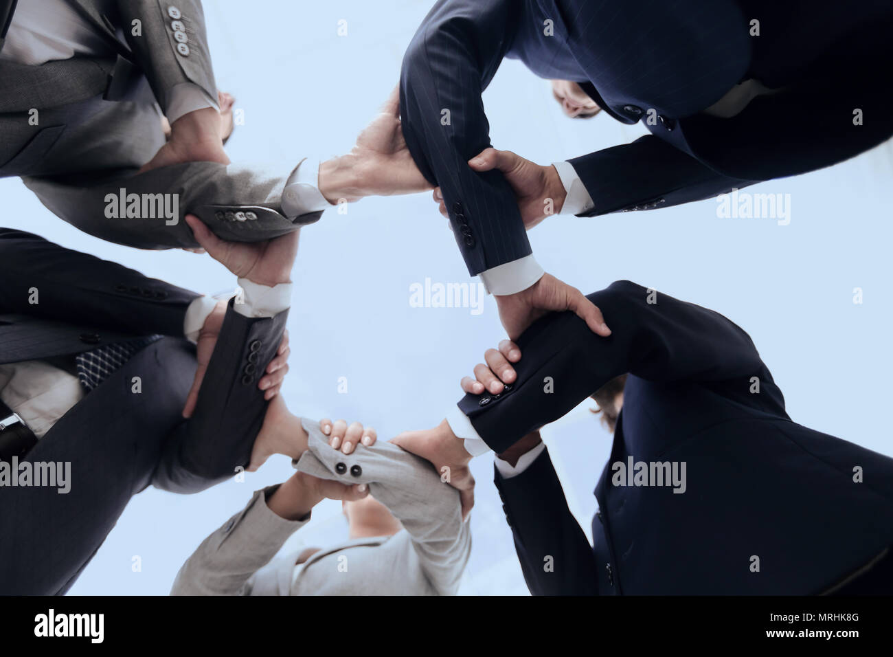 business team are taking each other's hands Stock Photo - Alamy