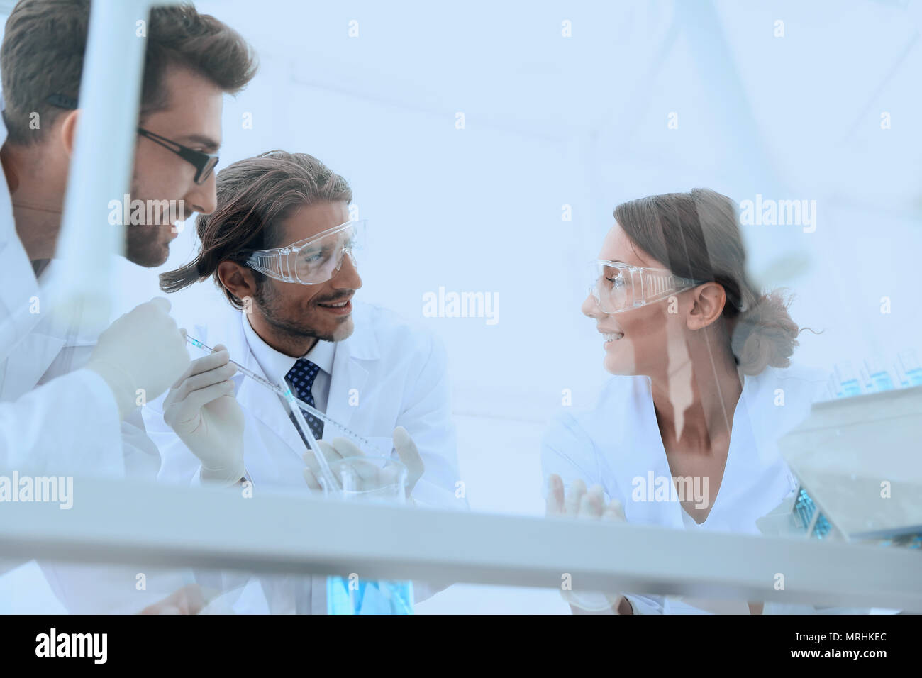 Group of scientists working on an experiment at the laboratory Stock ...