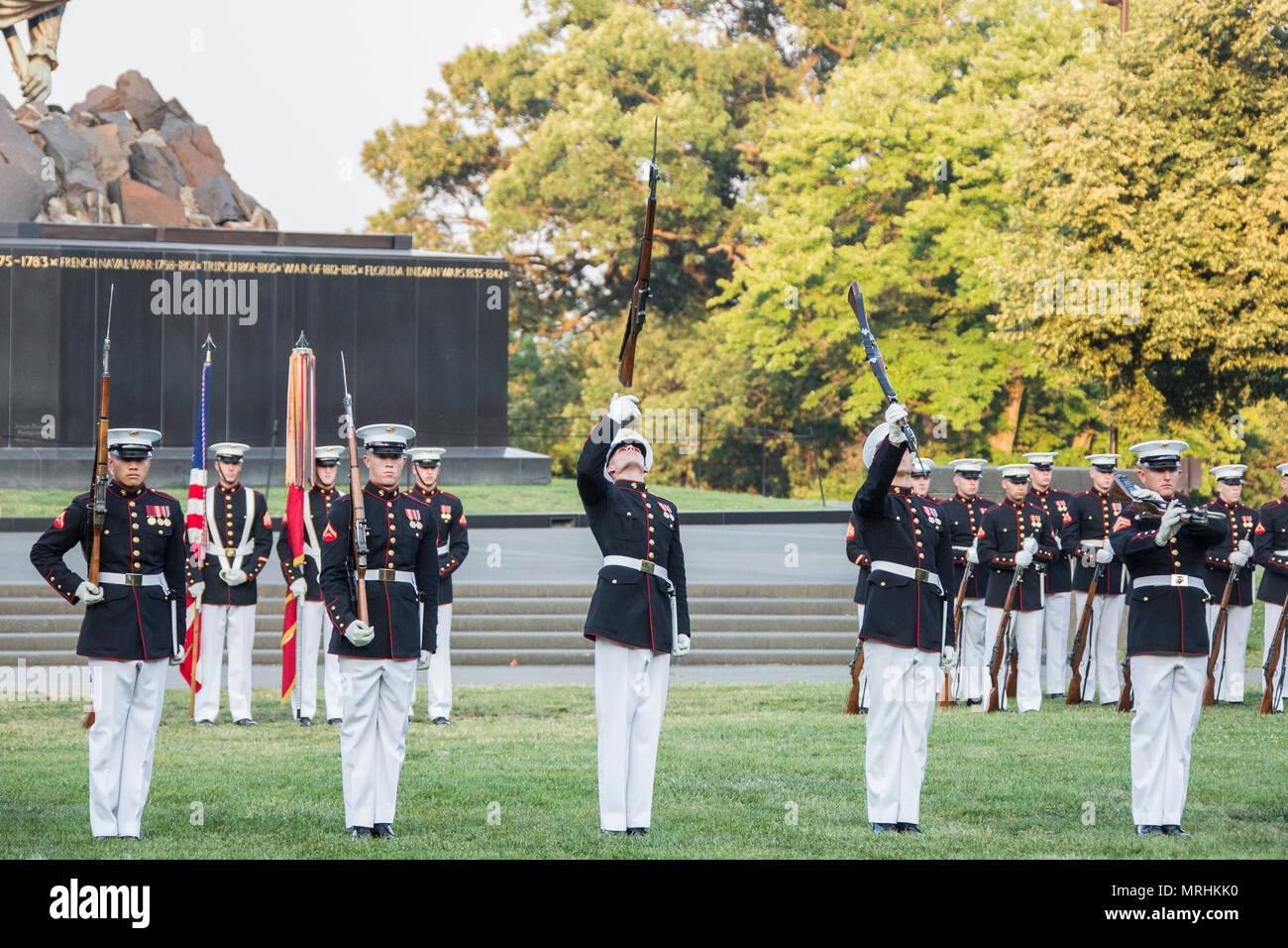 The U.S. Marine Corps Silent Drill Platoon performs during a sunset ...