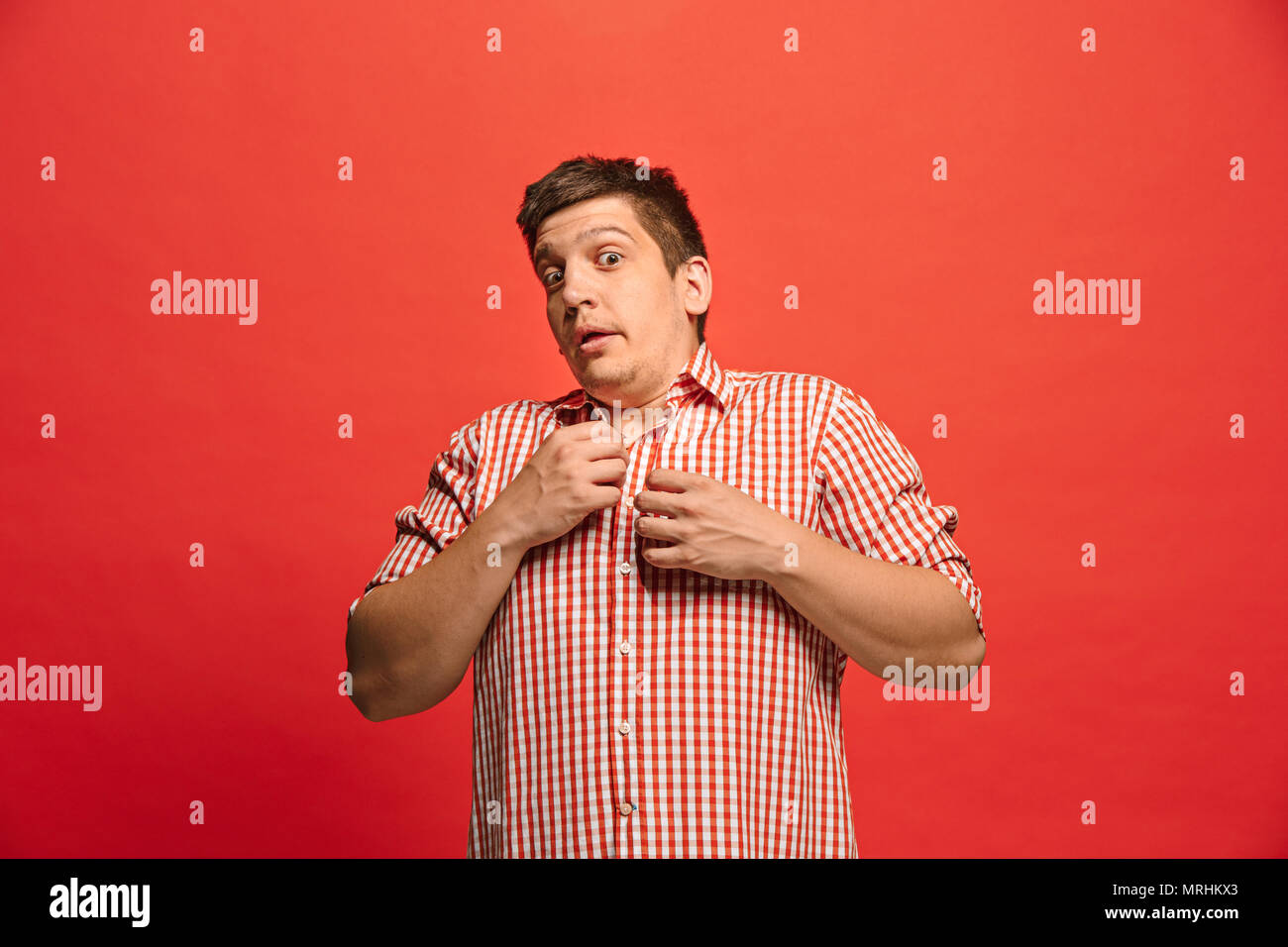 Portrait of the scared man on red Stock Photo - Alamy