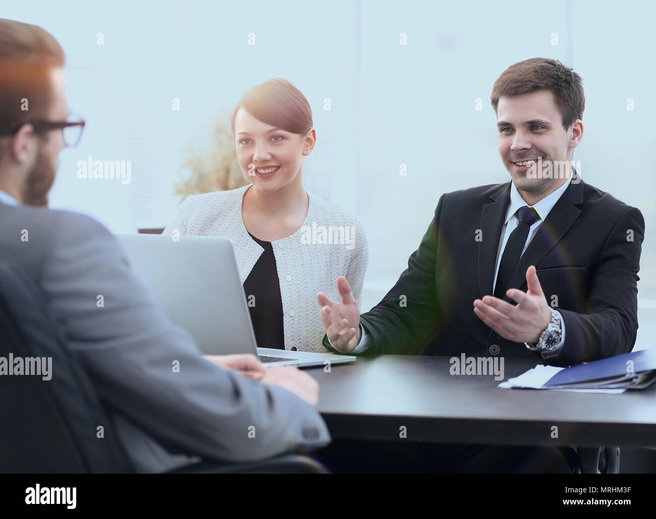 employees communicate with the customer in the office Stock Photo - Alamy