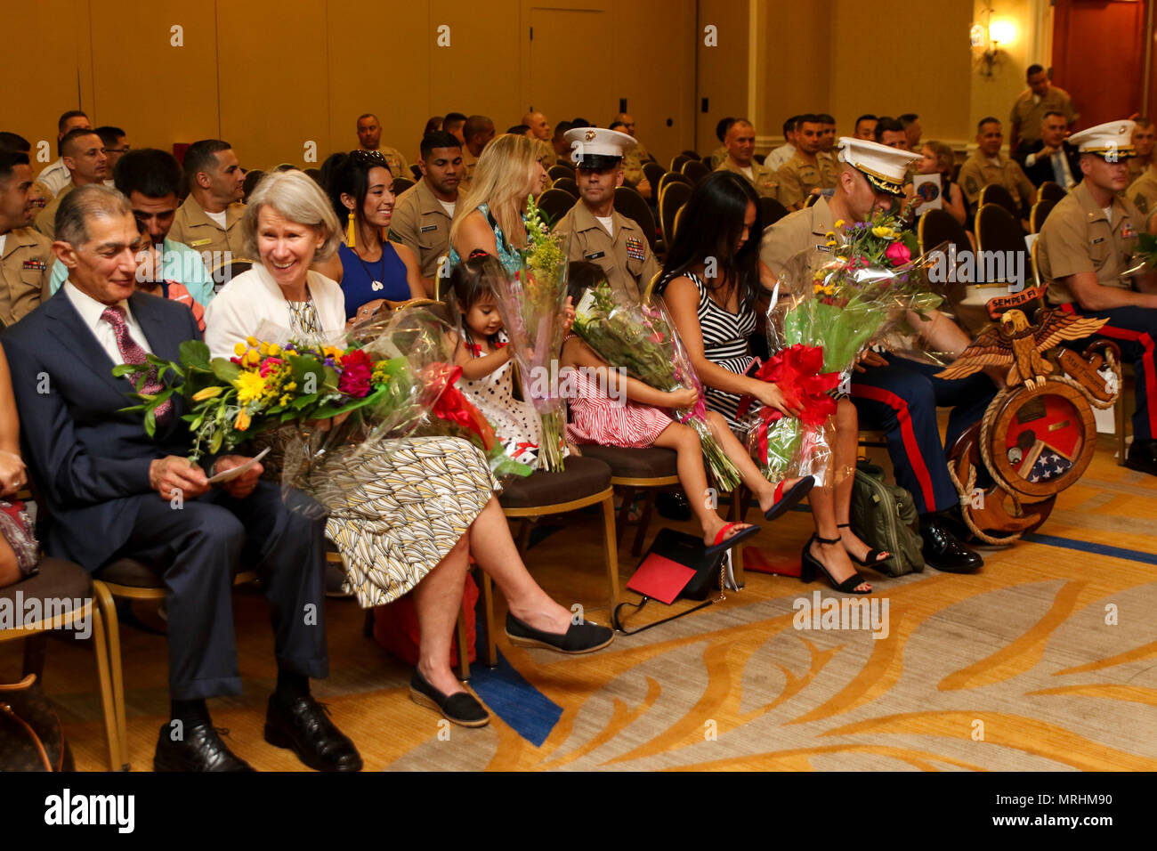 Flowers are presented to the family of Maj. David P. Tumanjan, out ...