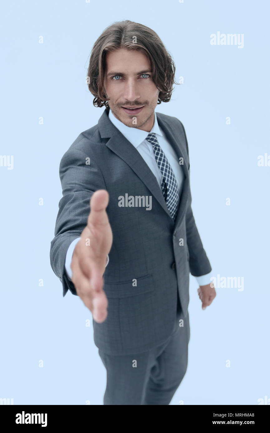 Businessman offering for handshake Stock Photo - Alamy