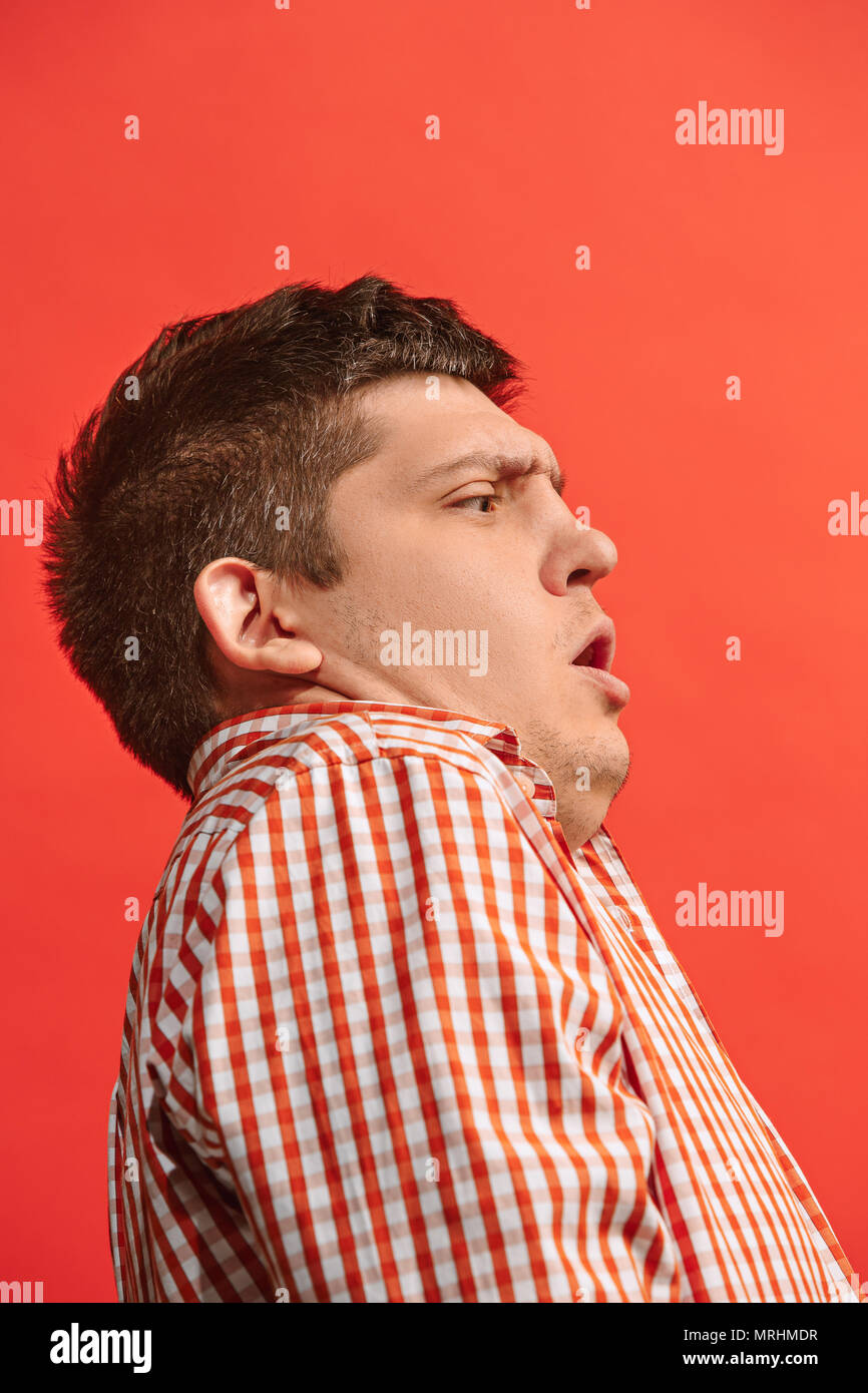 Portrait of the scared man on red Stock Photo - Alamy